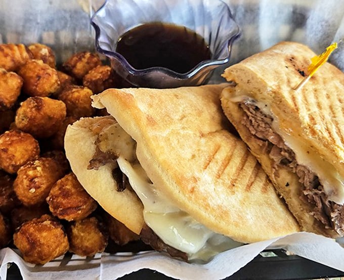 The Prime Melt Panini glistens with melted Swiss cheese, while thinly sliced prime rib peeks out, promising a flavor explosion with each bite.