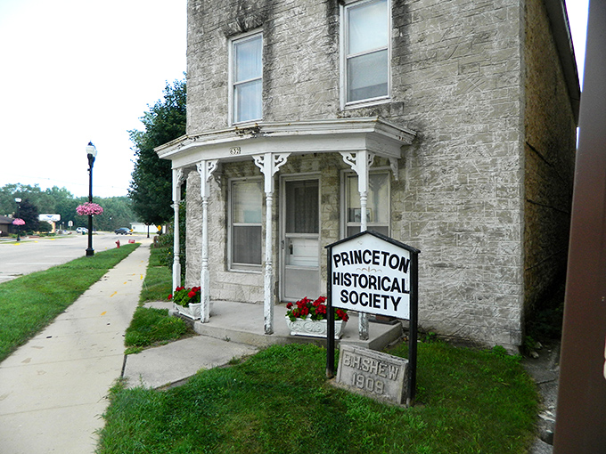 A vintage wedding dress stands sentinel among the collectibles, its timeless elegance a reminder of celebrations past and the enduring nature of true style.