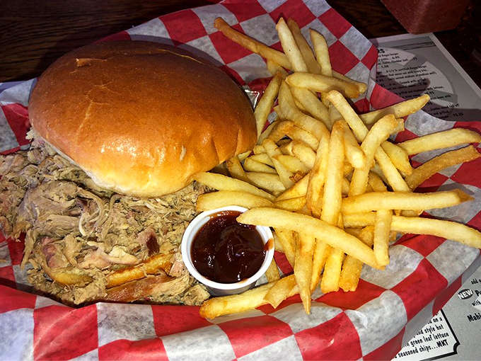 Mike's pulled pork sandwich brings smoky, tender goodness to the marina, proving their talents extend well beyond seafood.