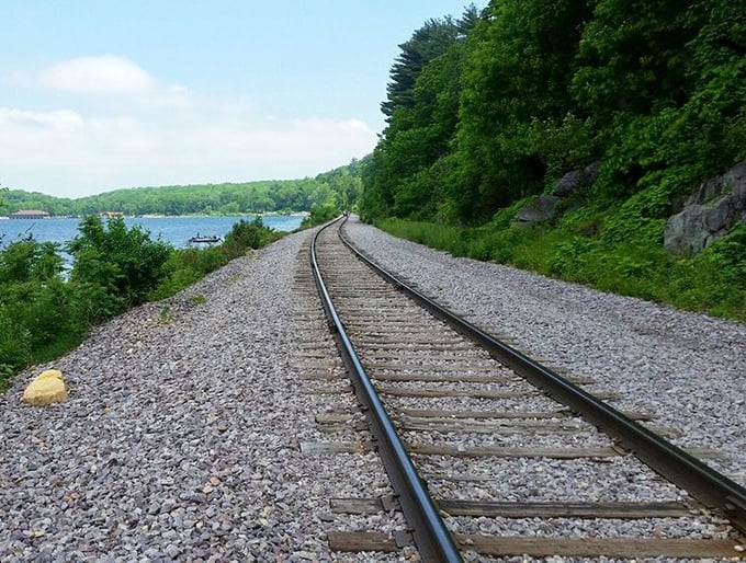 Train tracks hug the shoreline, a reminder of Victorian-era tourists who once arrived by rail to marvel at these same views.