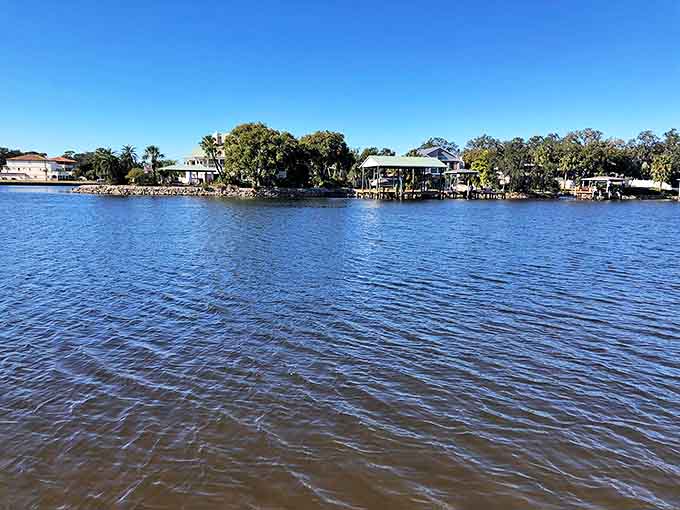 Waterfront homes with private docks showcase the enviable lifestyle of residents who wake up to this tranquil blue panorama daily.