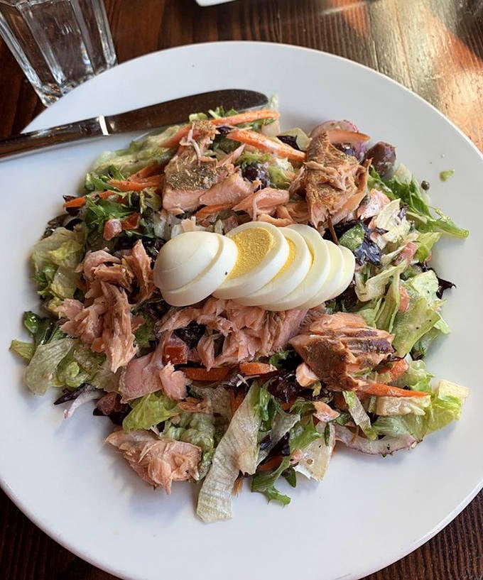 A salmon chopped salad that proves healthy eating doesn't have to be punishment—fresh, colorful, and topped with perfectly cooked fish.