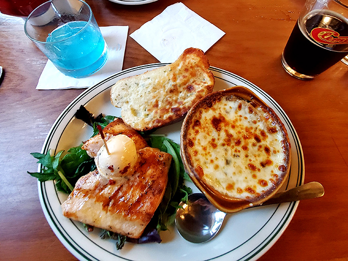 Perfectly grilled salmon shares the spotlight with that famous French onion soup &ndash; a duet of flavors that sings in perfect harmony.