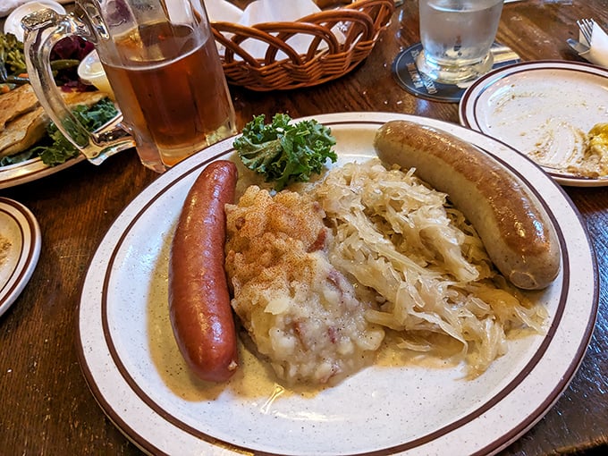 The holy trinity of German comfort: sausage, sauerkraut, and sp&auml;tzle. This plate doesn't just feed your body &ndash; it hugs your soul.