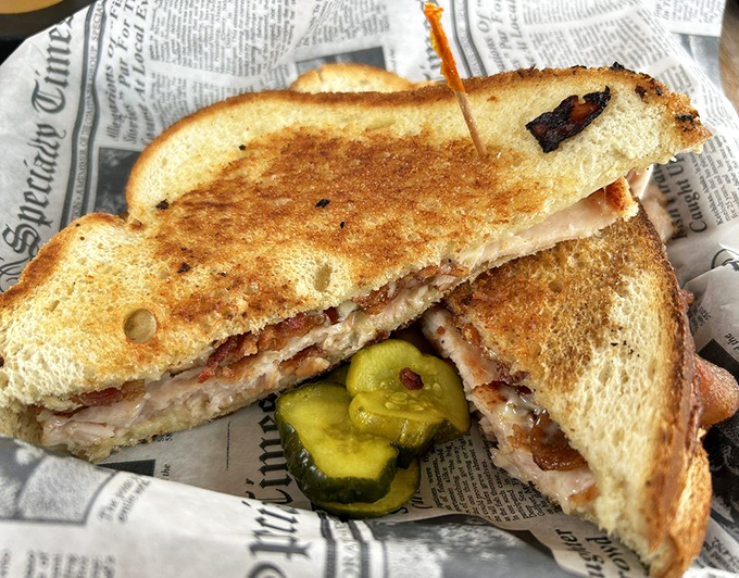 The Smoked Turkey Melt arrives like a warm hug on sourdough, with bacon and Swiss cheese playing supporting roles.