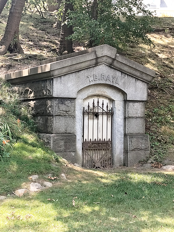 T.B. Rayl's hillside mausoleum appears like a mysterious doorway to another era, its iron gate guarding stories of Detroit's industrial past.