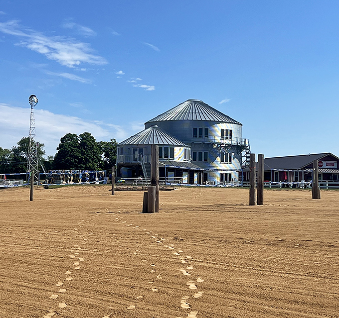 The distinctive silver structure stands like a beacon of fun against Michigan's blue skies, promising adventures that transcend ordinary water parks.