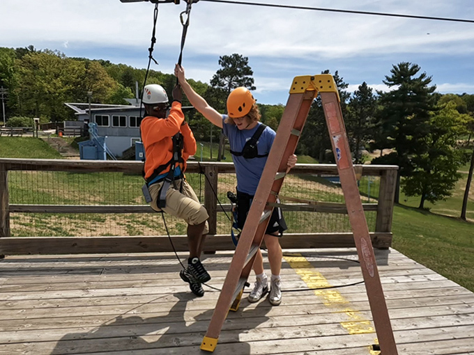 Zipline Launch Prep: The final countdown before gravity becomes your new best friend. That helmet isn't just for safety&mdash;it's for hiding your "help me" expression.