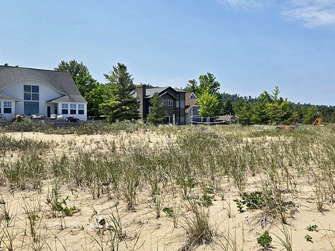 Charming beach houses line the shore, their weathered elegance telling stories of summers past and memories yet to be made.