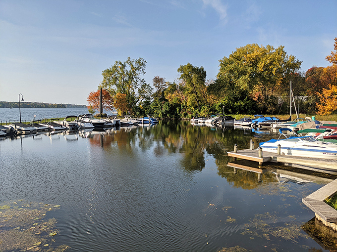 Boats nestle in their slips like birds returning to roost, mirroring the tranquil rhythm of lake life.