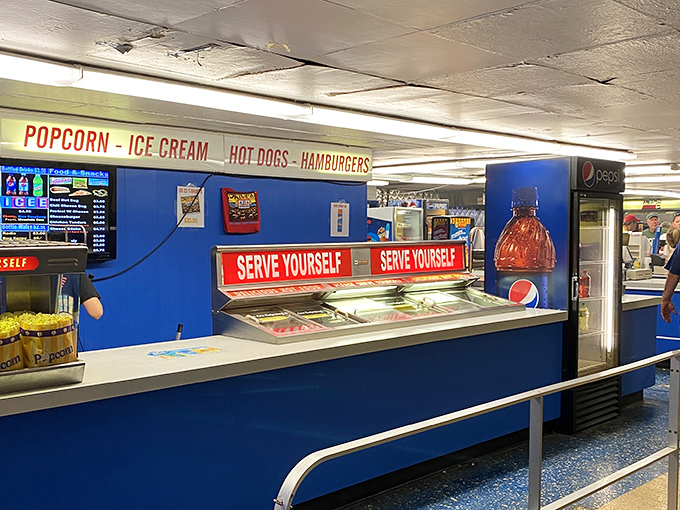 The concession stand beckons with its siren song of buttery popcorn, hot dogs, and ice cream &ndash; the holy trinity of drive-in dining.