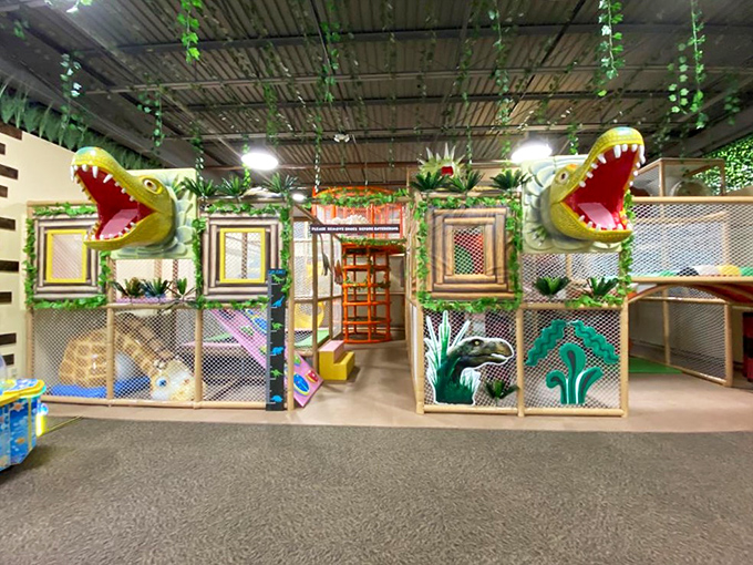 Little paleontologists can explore this jungle-themed play structure complete with chomping dinosaur heads that are more giggly than scary.