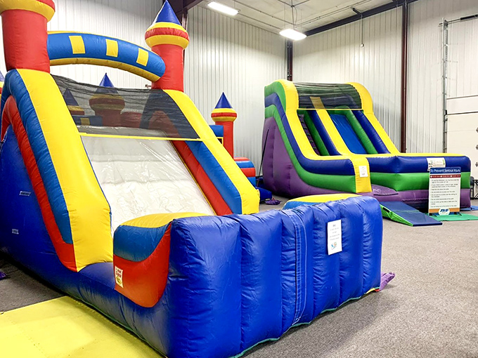 Inflatable castles and slides transform the space into a bouncy kingdom where even the most dignified adults surrender to childlike joy.