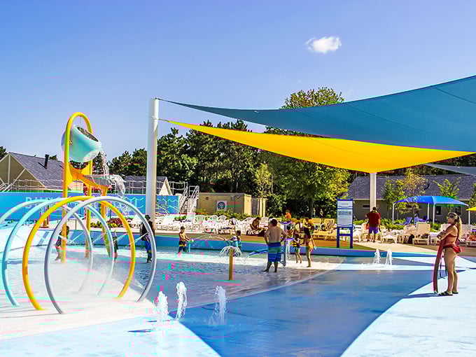 Guests enjoy the splashing fun and shaded water play area, a perfect spot for the park's littlest visitors.