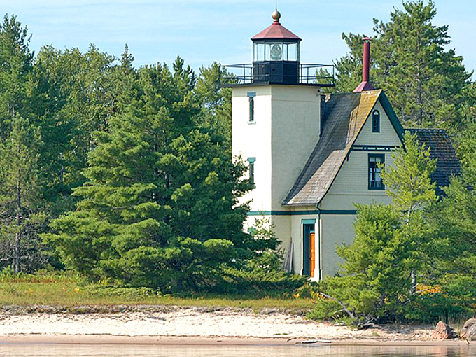 The historic lighthouse stands watch, a perfect backdrop for those "no, this really IS Michigan" photos.