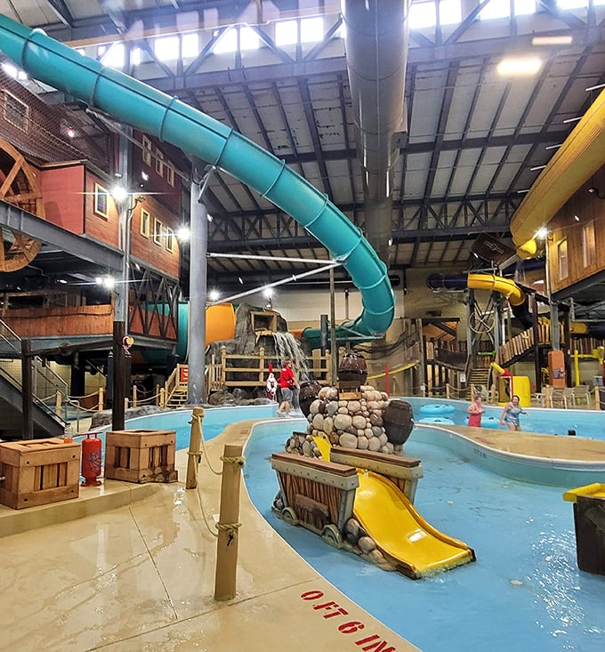 The heart of Gold Rush's aquatic adventure, where colorful slides empty into inviting pools surrounded by western-themed architecture.