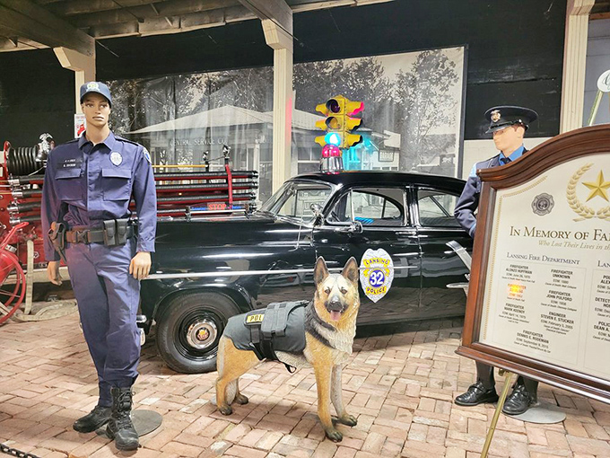 This vintage police cruiser and K-9 unit display captures law enforcement history, complete with period-correct equipment and an era when sirens were mechanical.