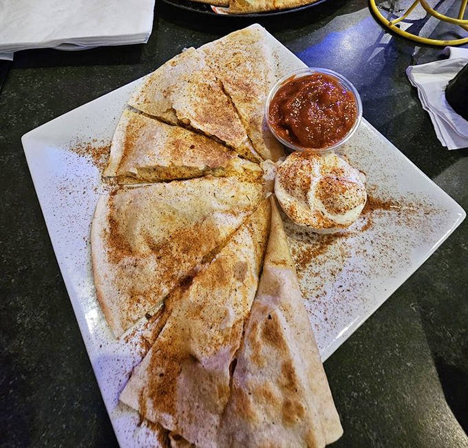 The quesadilla &ndash; Earth's perfect food made even better with melty cheese, fresh toppings, and a dusting of cosmic spices that elevate this simple dish.