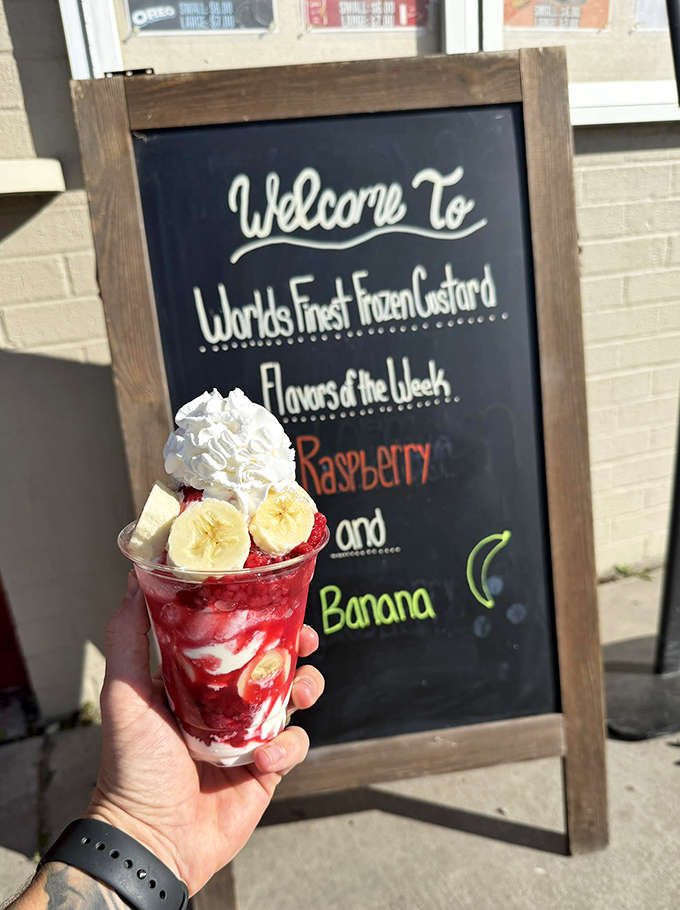 A raspberry and banana parfait that's practically winking at you &ndash; layers of creamy custard, fresh fruit, and whipped cream in perfect harmony.