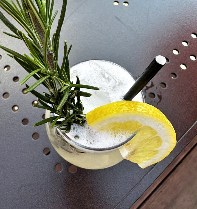 Fresh rosemary and lemon transform this cocktail into an aromatic garden in a glass – refreshing salvation on a hot Michigan day.