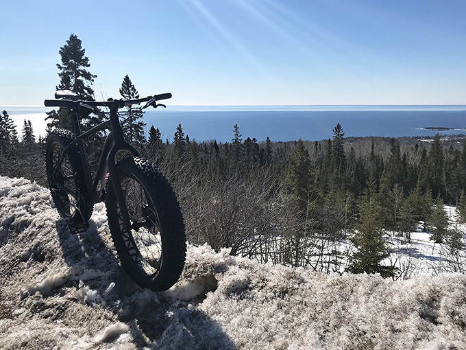 Fat tire bikes find their happy place on Pincushion's trails, where winter transforms the landscape into a snow-covered playground.