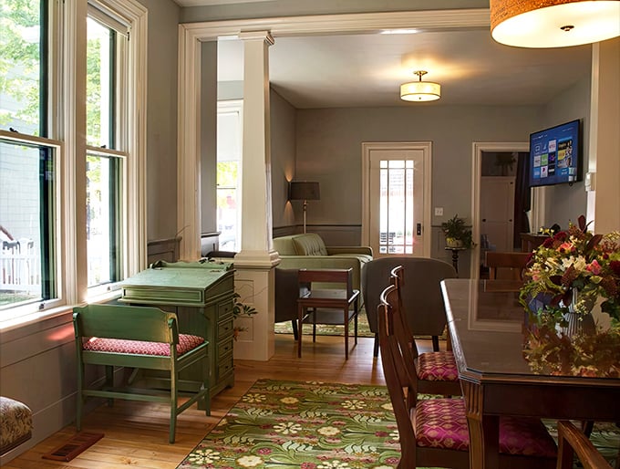 Sunlight streams through tall windows, highlighting architectural details that whisper stories from decades past.