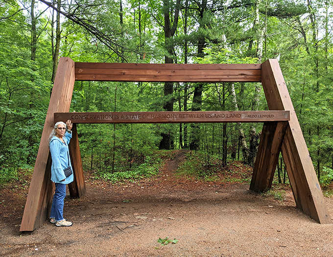 "Conservation is a state of harmony between men and land" – the entrance archway sets the philosophical tone for your adventure.