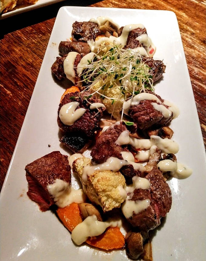 Filet Mignon Beef Bites: Tender morsels of perfectly medium-rare beef nestled among seasonal vegetables, crowned with a creamy sauce worth savoring.
