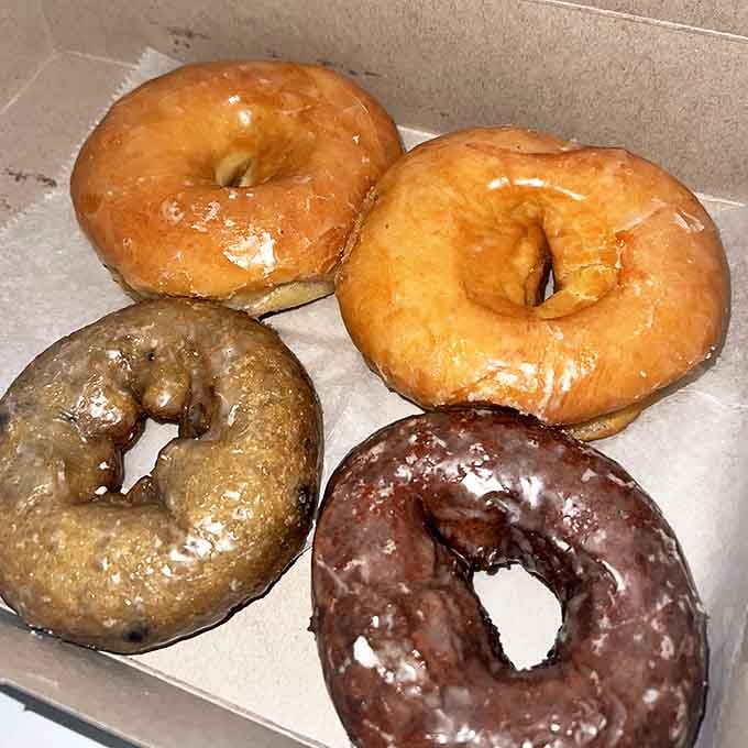 Four perfectly executed glazed donuts that prove sometimes the simplest pleasures are the most profound.