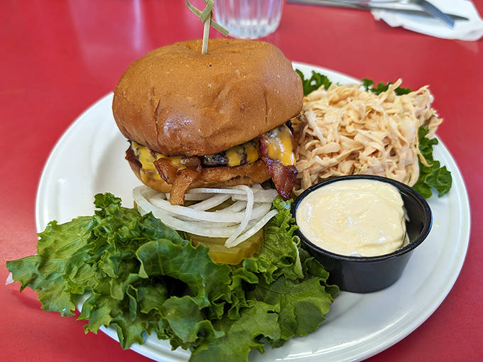 Crispy bacon adds another dimension to the already perfect cheeseburger – simple additions that enhance without overwhelming the star of the show.