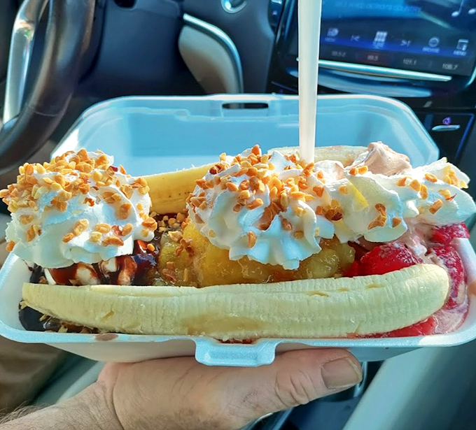 This banana split isn't just dessert &ndash; it's architecture, sculpture, and pure indulgence all nestled in a plastic boat.