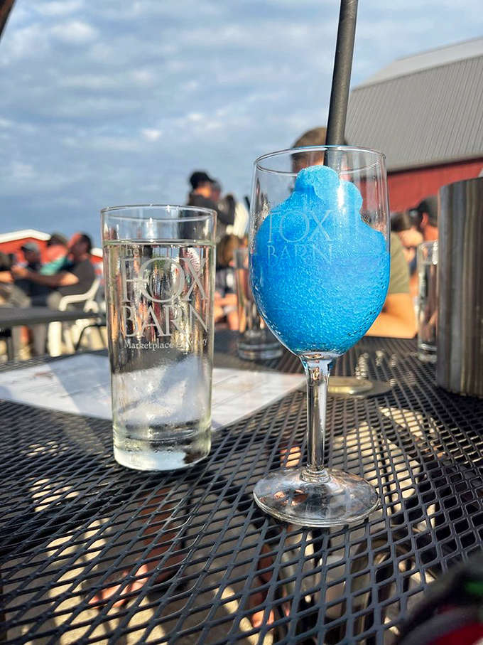 Not your average wine slushie! This electric blue raspberry frozen concoction proves that sophisticated venues can still embrace playful offerings.