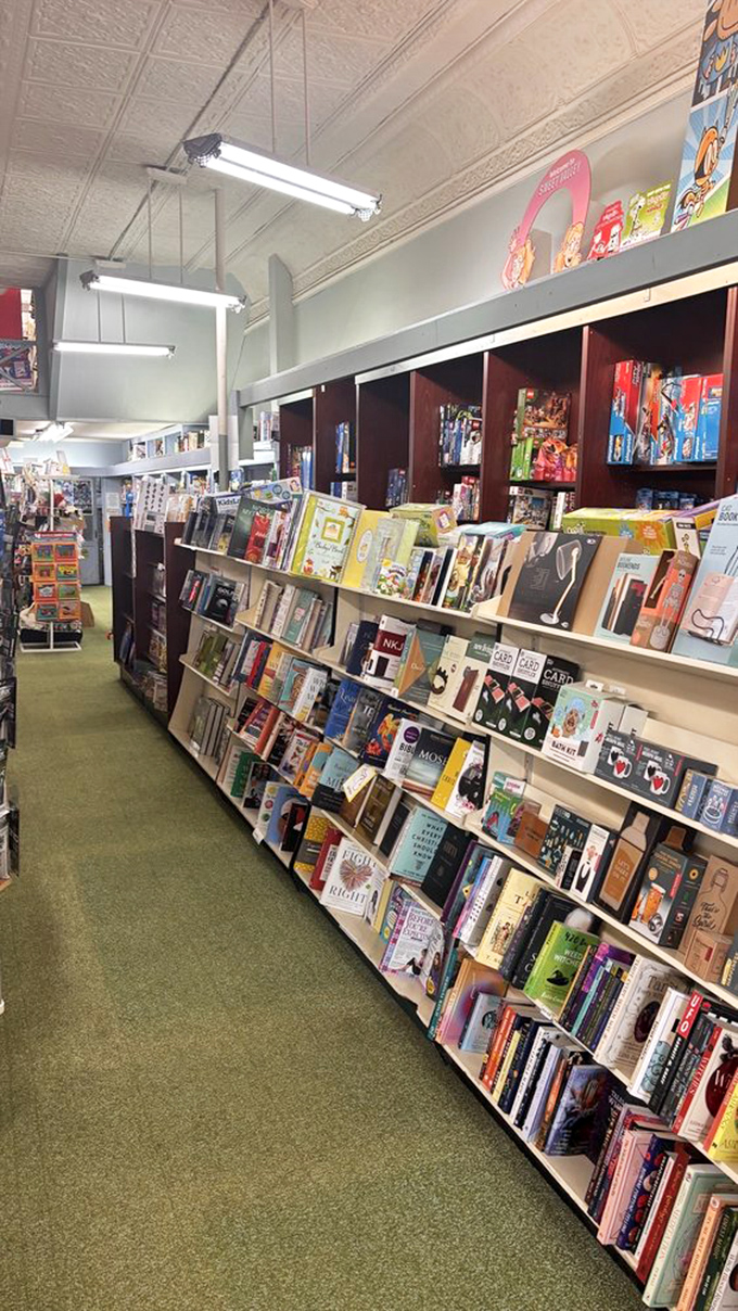 Books upon books upon books, the green-carpeted aisles invite you to get lost in literary worlds.