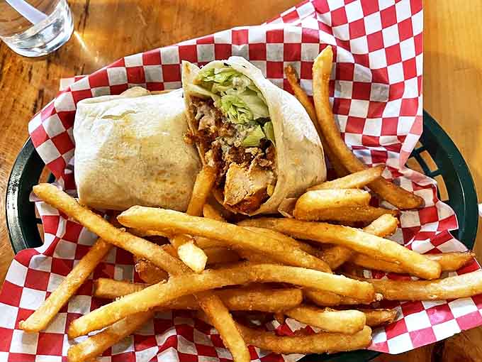 This buffalo chicken wrap brings the heat without setting your mouth on fire, nestled alongside fries that are crispy on the outside, fluffy within.