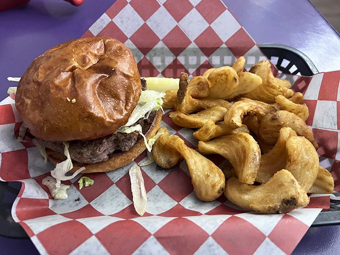 This isn't some architectural burger monstrosity requiring surgical skills to eat &ndash; it's an honest-to-goodness hand-formed patty on a proper bun with house-made curly fries.