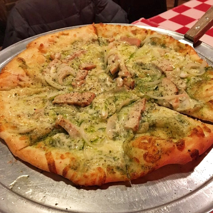 Chicken pesto pizza that makes you question all other toppings &ndash; the perfect balance of herb-infused oil, tender meat, and that legendary sourdough base.