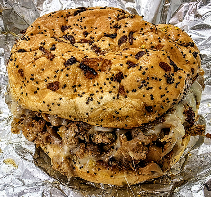 This isn't just a sandwich &ndash; it's an architectural marvel of melted cheese, caramelized onions and seasoned meat on a perfectly toasted bagel.