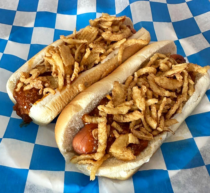 Crispy french fries add the perfect crunchy companion to these chili dogs topped with golden fried onions.