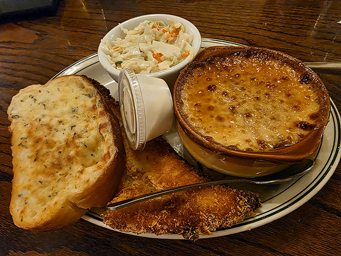 Comfort food perfection: golden-brown cheese toast, creamy cole slaw, and the French onion soup that put Clementine's on the culinary map.