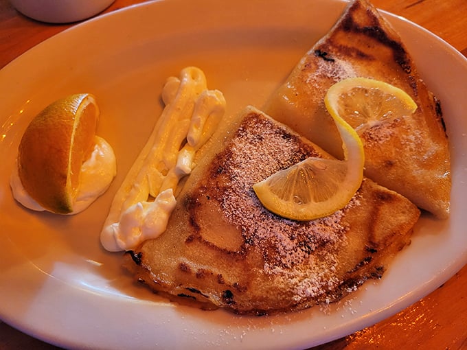 Golden potato pancakes with applesauce and sour cream &ndash; crispy outside, tender inside, and completely impossible to stop eating. 