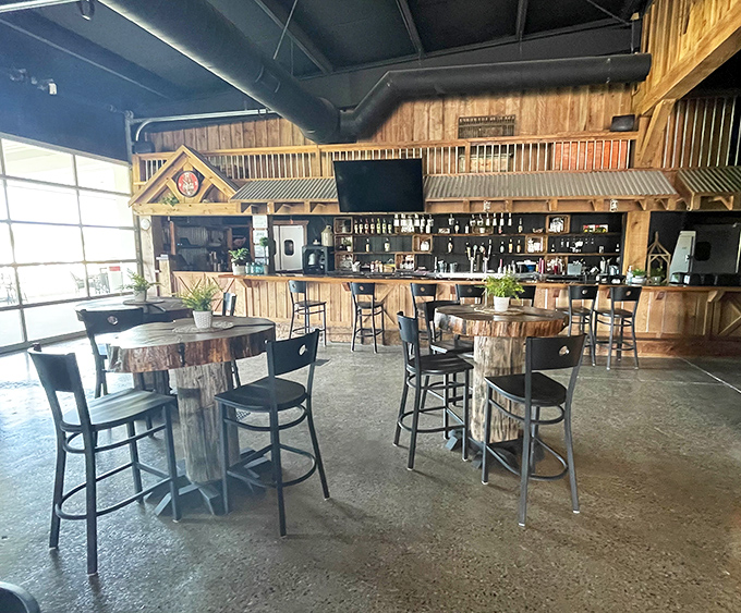 Firewater Bar & Grill's rustic charm offers the perfect post-splash retreat, where barrel tables and wooden accents complement hearty, satisfying fare.