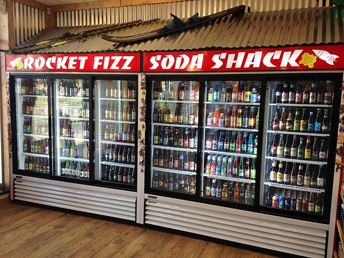 The "Soda Shack" isn't just refrigerated shelving, it's a United Nations of carbonation where countries peacefully coexist through bizarre flavor diplomacy.