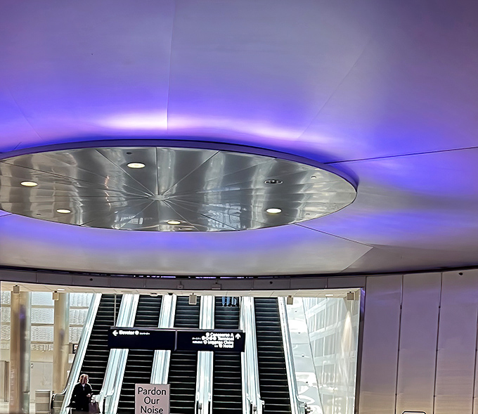 Ascending from the tunnel's kaleidoscopic embrace back to the regular terminal feels like reluctantly returning to reality after a brief, beautiful dream.