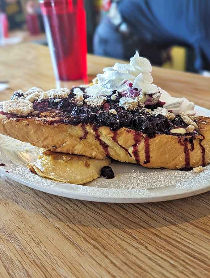 Blueberry French toast that looks like it should be behind velvet ropes in a dessert museum.