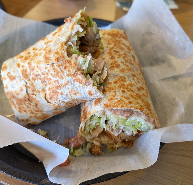 The grilled chicken burrito proves that poultry can be just as exciting as its beefy counterparts when treated with proper respect and excellent seasoning.