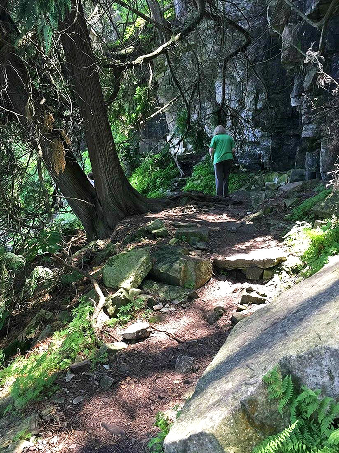 Follow the path less traveled into this mystical stone corridor, where every step echoes with natural history.