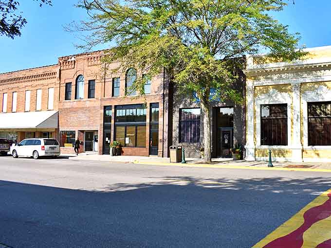 Historic buildings line the streets with their brick facades and large windows, silently telling stories of the town's rich commercial past.