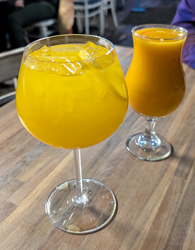 Sunshine in glassware! The mango lemonade brings tropical brightness that makes Michigan winters feel like a distant memory.