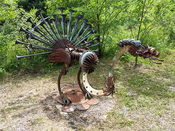 Metal peacocks strut their industrial plumage, proving beauty can emerge from the most unlikely materials.