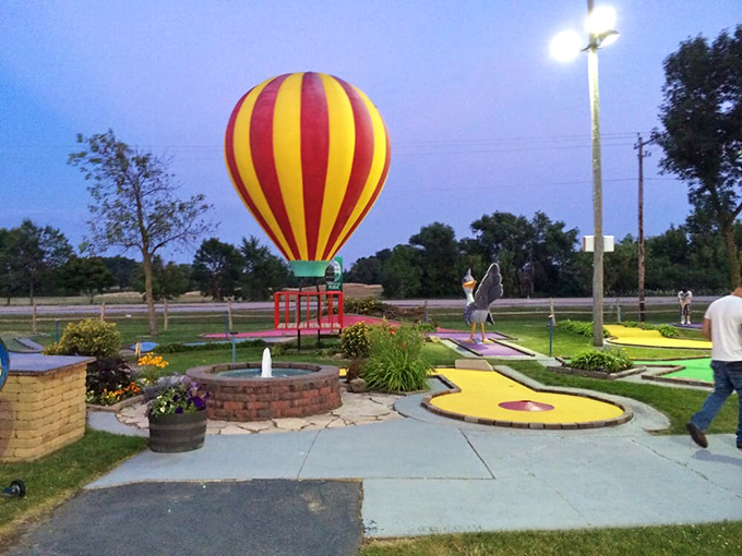 Miniature golf under evening skies &ndash; the park offers land activities too, including this charming course with a hot air balloon feature.